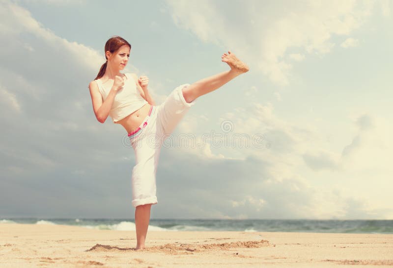 Woman performing a kick stock image. Image of kick, kickboxing - 31331647