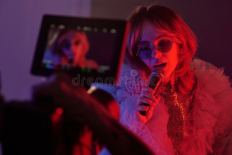 Woman Performing during Music Video Shoot Stock Photo - Image of female ...