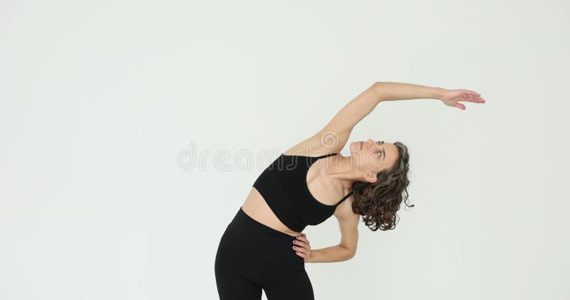 Woman Performs Lateral Stretch Exercise on White Background Stock ...