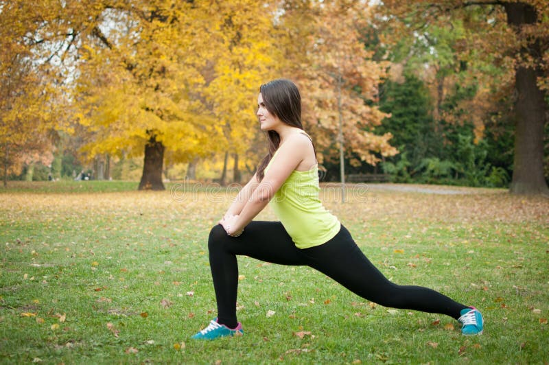 Woman Performs Stretching before Jogging Stock Photo - Image of ...