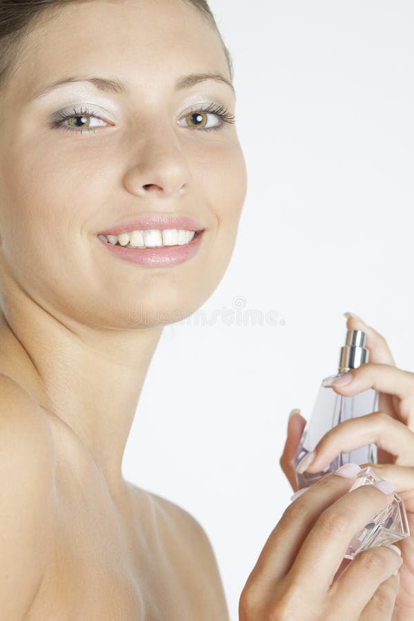 Woman spraying perfume stock photo. Image of perfume, singlet - 1774992