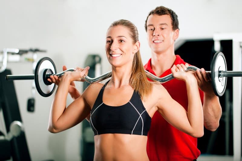 Woman with Personal Trainer in Gym Stock Image - Image of exercise ...
