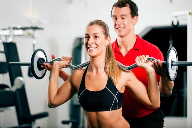 Woman with Personal Trainer in Gym Stock Image - Image of couple ...