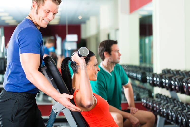 Woman with Personal Trainer in Gym Stock Image - Image of couple ...