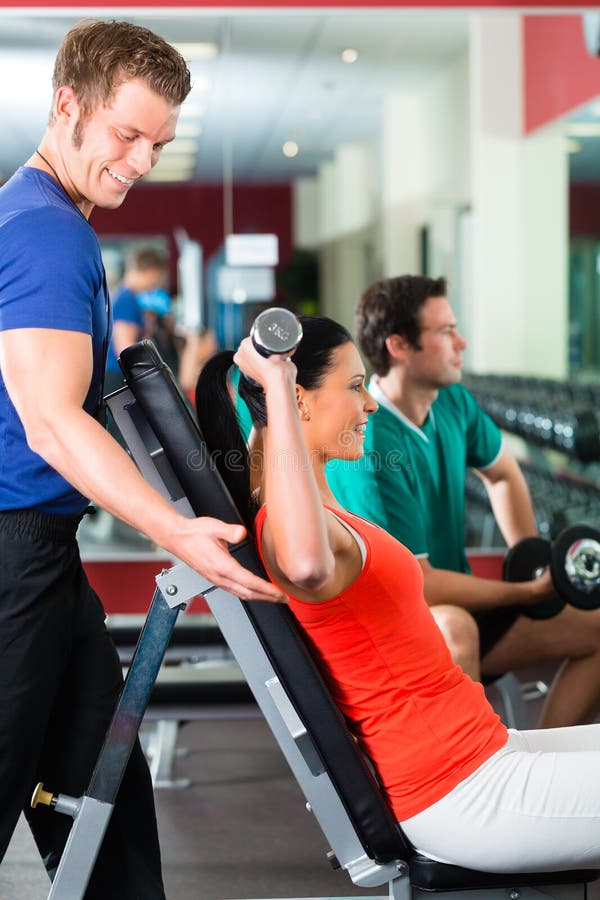 Personal Trainer in gym stock photo. Image of bells, health - 15160020