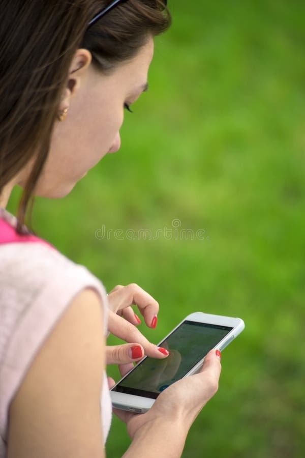 Woman with Phone in Her Hand Stock Photo - Image of phone, online: 57223768