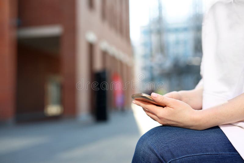 Woman with a Phone. Writing Messages on the Communicator on Your ...