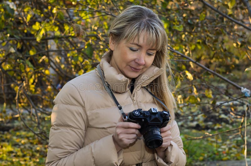 Woman Photographer Looking at the Camera Stock Photo - Image of looking ...