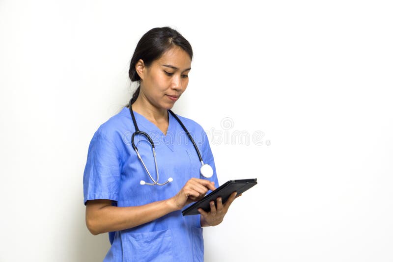 Woman Physical Therapist in Blue Uniform and Stethoscope Typing on ...