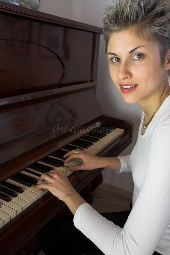 Woman and piano stock photo. Image of ivoryblack, hobby - 2096562