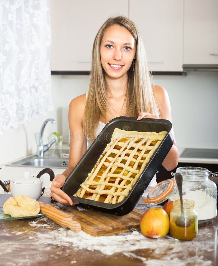 Woman with a pie in hand stock image. Image of flour - 55605585