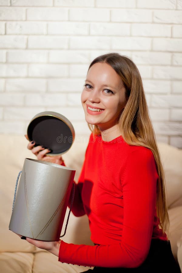 Woman with Pile of Presents at Home Stock Image - Image of package ...