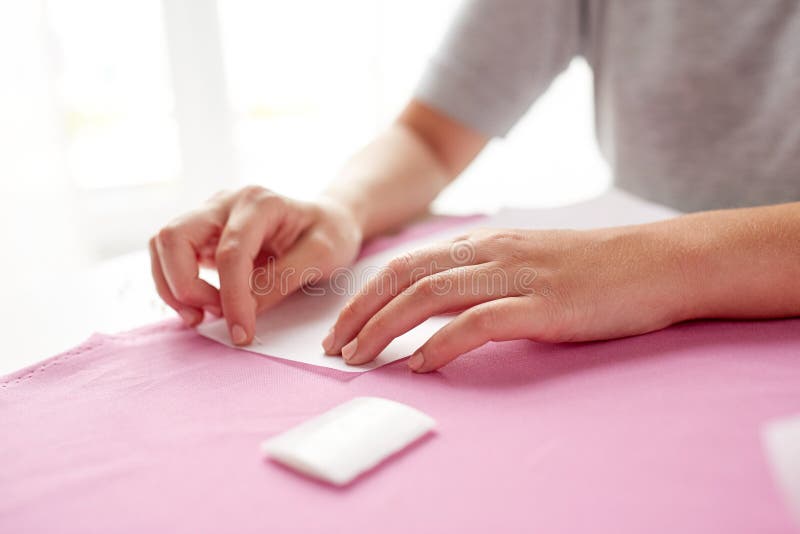 Woman with Pins Stitching Paper Pattern To Fabric Stock Image - Image ...