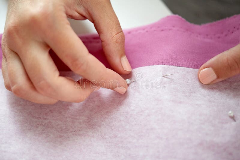 Woman with Pins Stitching Paper Pattern To Fabric Stock Photo - Image ...