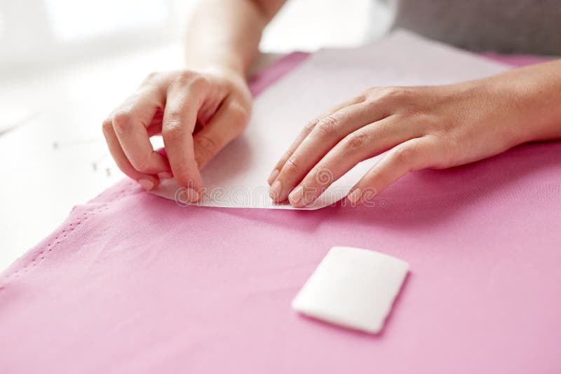 Woman with Pins Stitching Paper Pattern To Fabric Stock Photo - Image ...