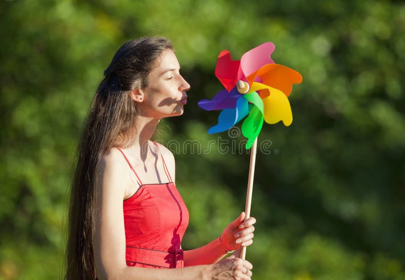 Woman with pinwheel stock photo. Image of person, people - 20131214