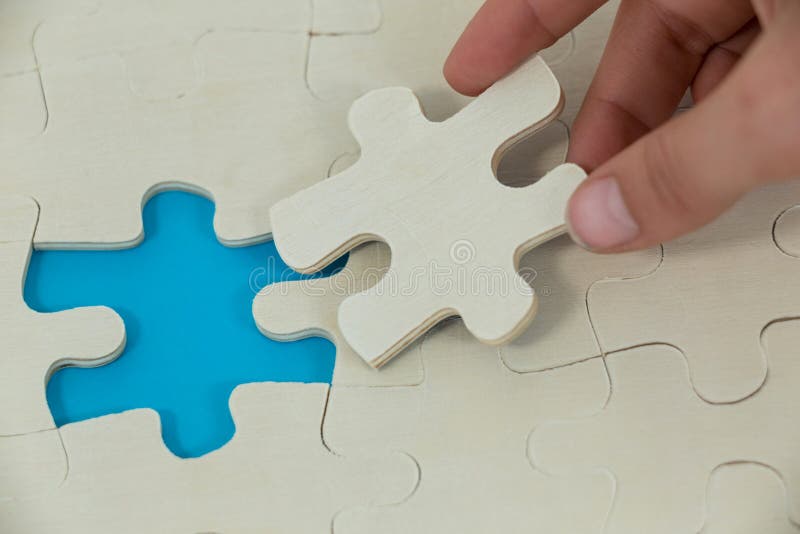 Man Placing Puzzle Piece Stock Photos - Free & Royalty-Free Stock ...