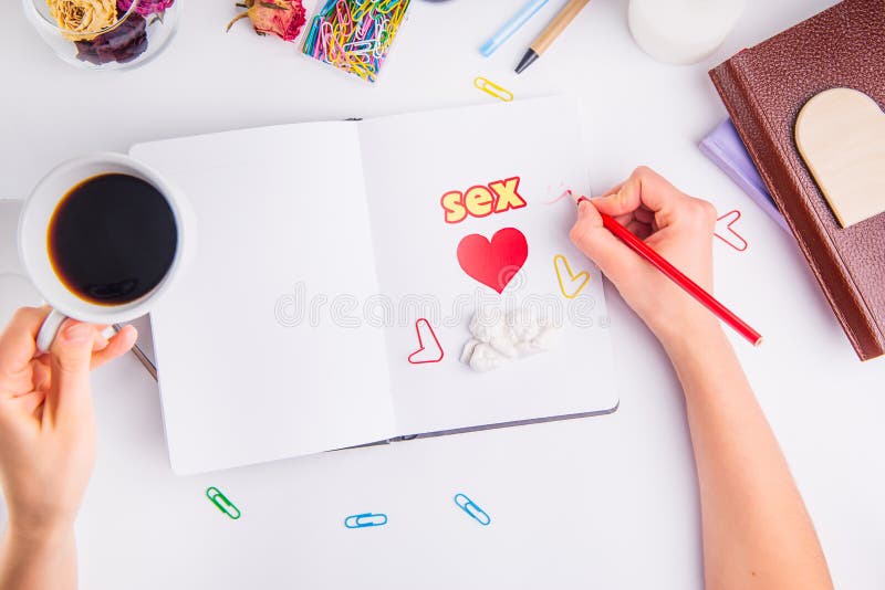 Woman Planing Date And Sex In Her Personal Organizer Hands With Pencil