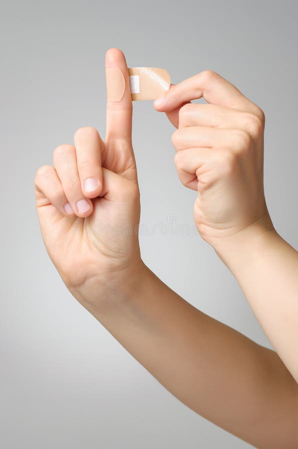 Woman with a Plaster on Her Finger Stock Photo - Image of bandaged ...