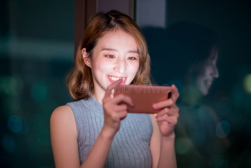 Woman play mobile game stock image. Image of play, downtown - 129447645