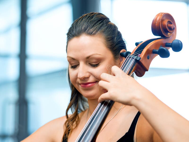 Woman playing cello stock image. Image of seat, player - 132043527
