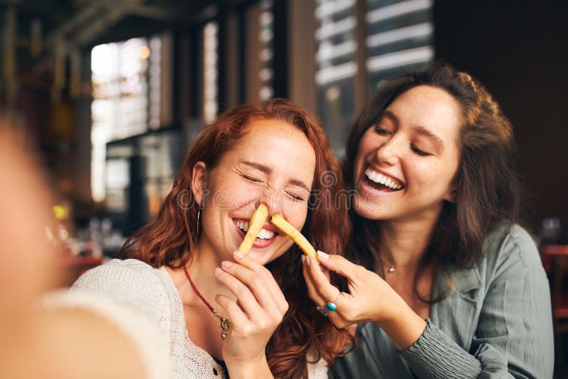 Woman Playing with Food and Laughing in Restaurant Stock Photo - Image ...