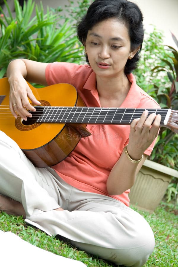 Woman playing guitar stock photo. Image of sing, female - 9914028