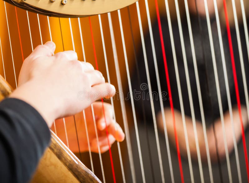 Woman Playing The Harp Stock Photo - Image: 39793573