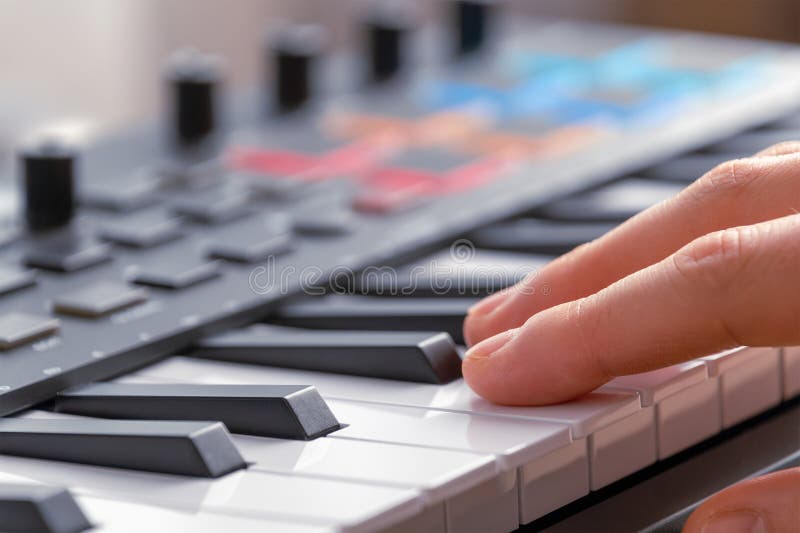 Woman Playing MIDI Keyboard with Control Knobs and Pads, Close-up Stock ...