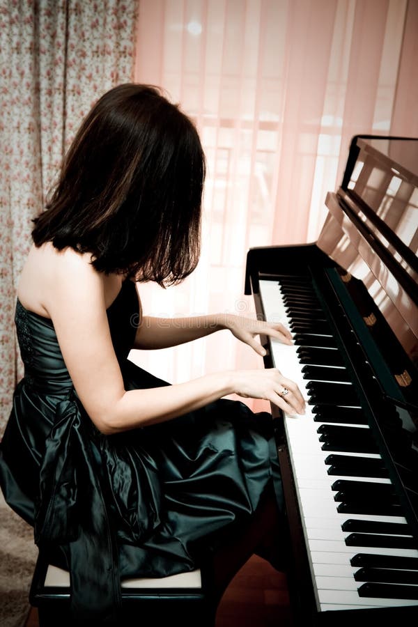 Woman playing piano stock image. Image of education, indoors - 12506751