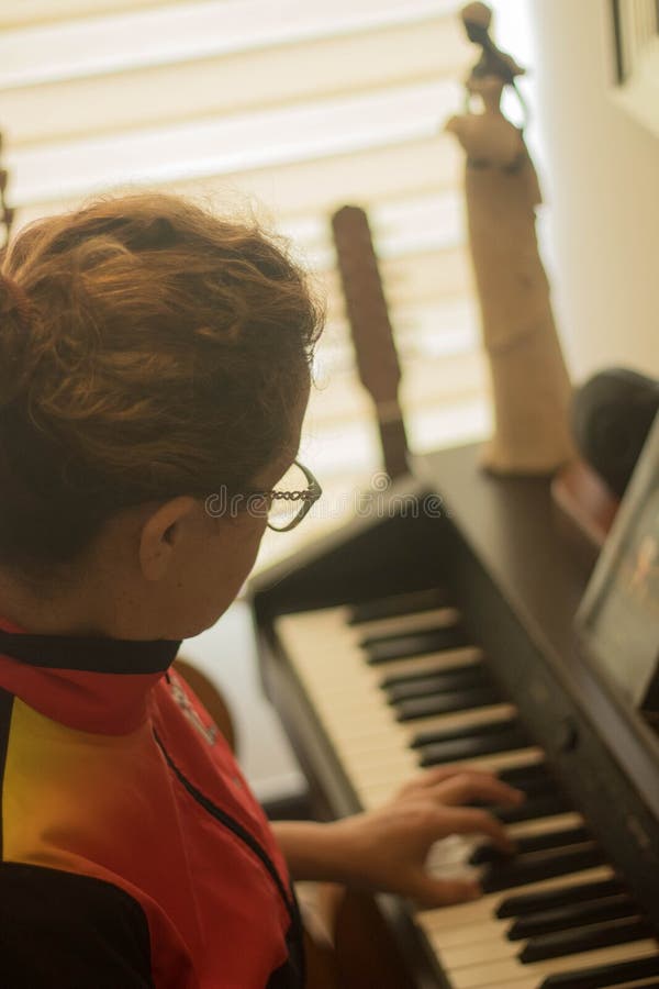 Woman playing piano stock photo. Image of concert, artistic - 184011322