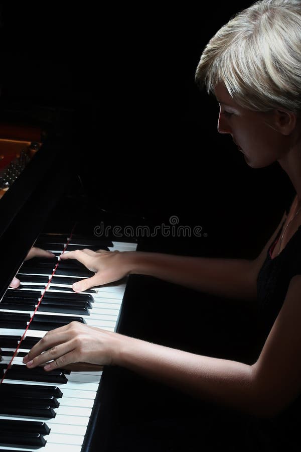 Woman playing piano stock image. Image of closeup, grand - 61938465