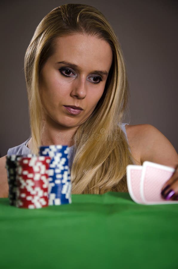 Woman Playing Poker With A Lot Of Money And A Gun Picture. Image: 8136373