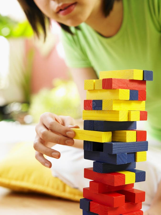 Woman Playing Stack Wood Game Stock Photo - Image of home, happiness ...