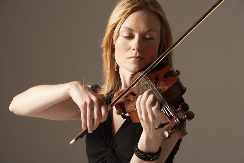 Woman Playing Violin in Studio Stock Photo - Image of musical, elegant ...