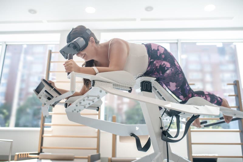 Woman Playing a VR Game Using a VR Simulator Stock Photo - Image of ...