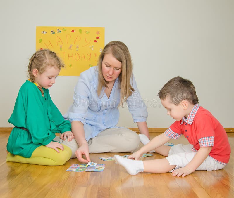 Woman plays with children stock photo. Image of class - 39613306