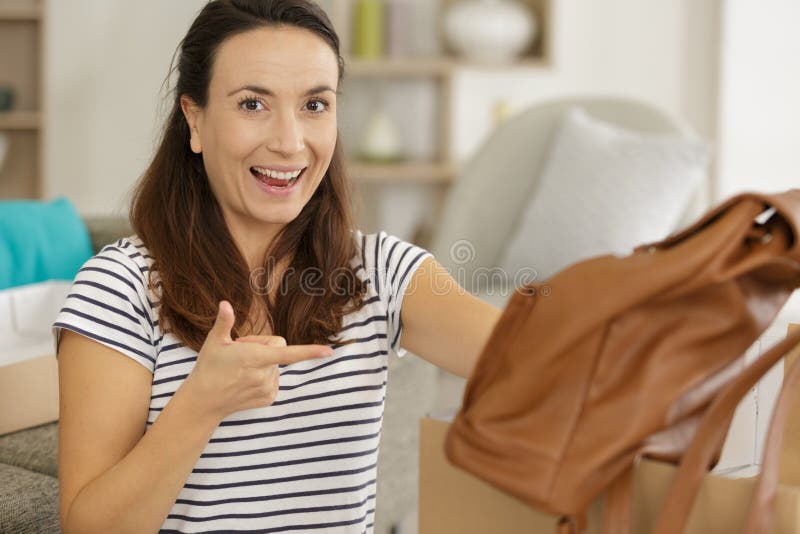 Woman Pointing at Bag she Ordered Stock Photo - Image of retail ...