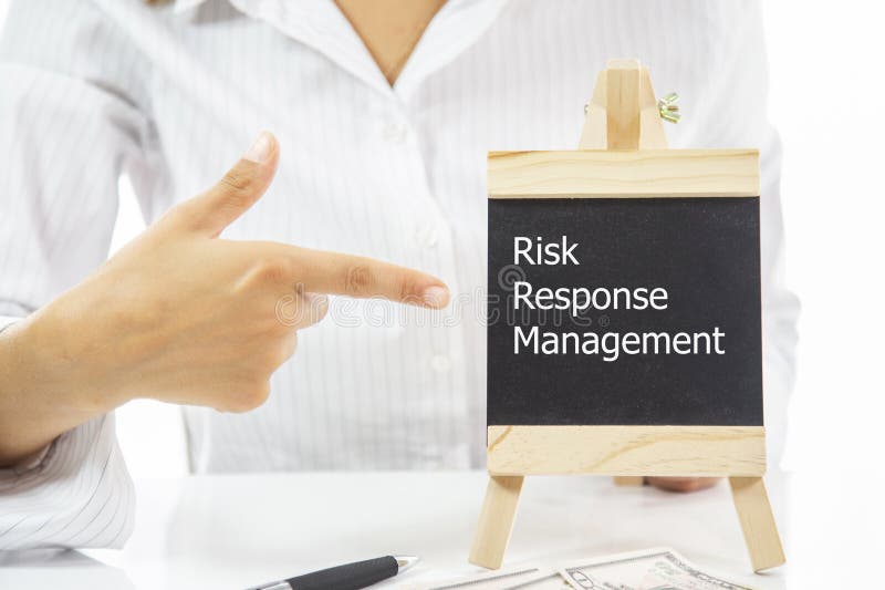 A Woman Pointing at a Blackboard with the Word Risk Response Management ...