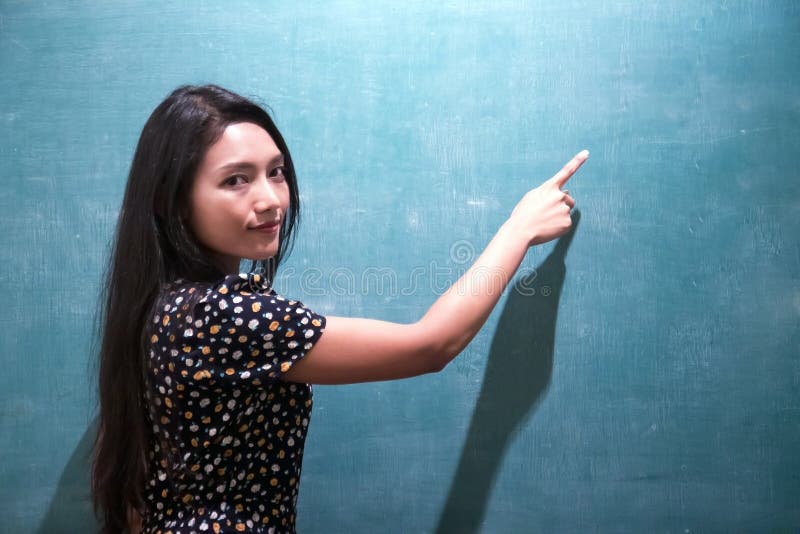 Woman Pointing Finger at Board Stock Image - Image of classroom, guess ...