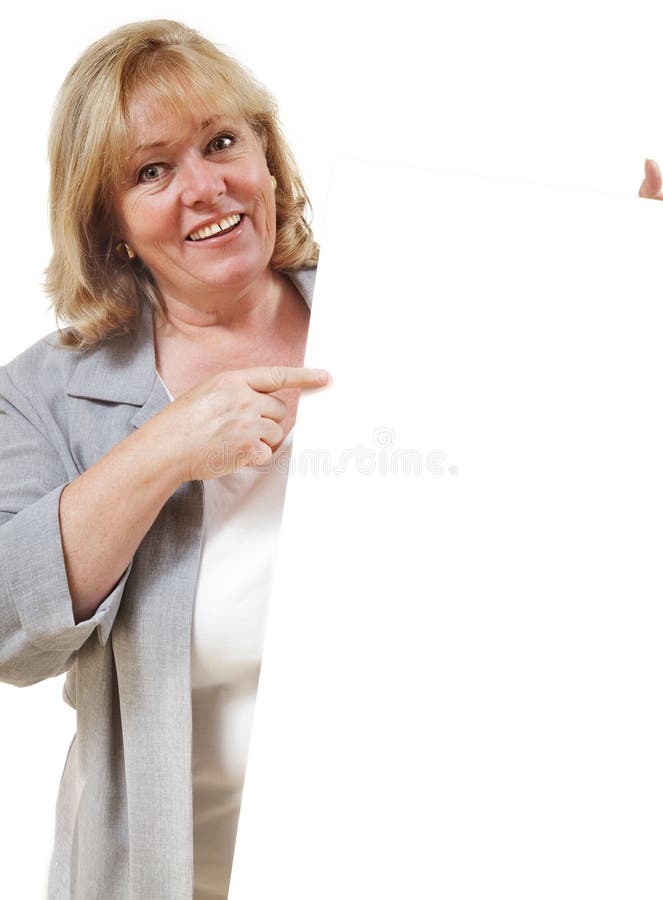Woman pointing at sign stock photo. Image of smiling - 19774130