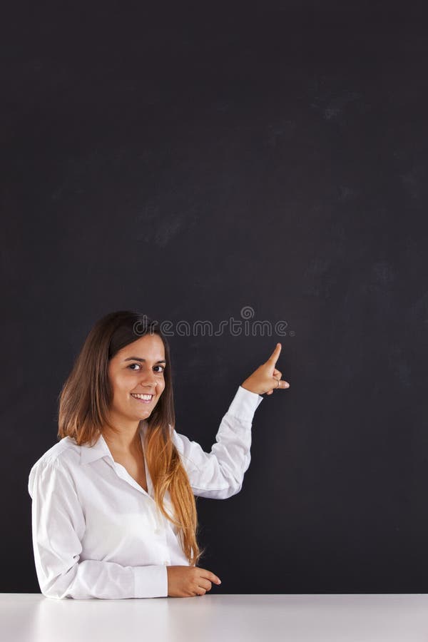 Woman Pointing To a Blackboard Stock Photo - Image of confident, school ...