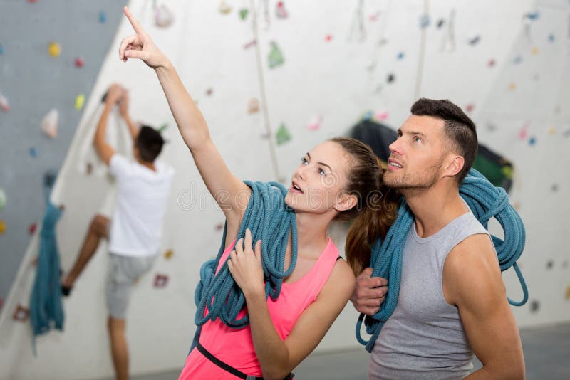 Woman Pointing Up at Indoor Climbing Wall Stock Image - Image of ...