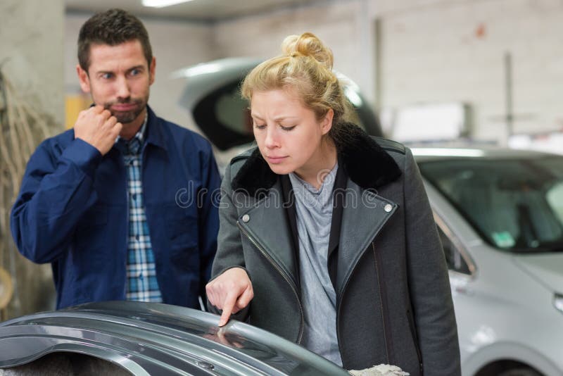 Woman Pointing at Vehicle Panel Damage Man Making Exasperated ...