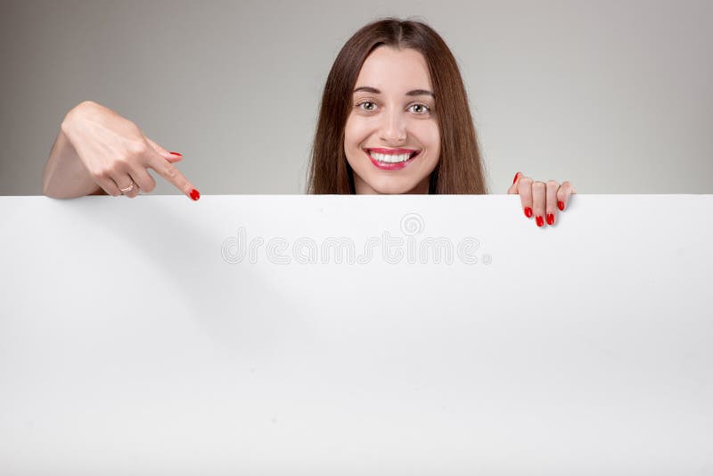 Woman Pointing on White Billboard Over Grey Stock Photo - Image of ...