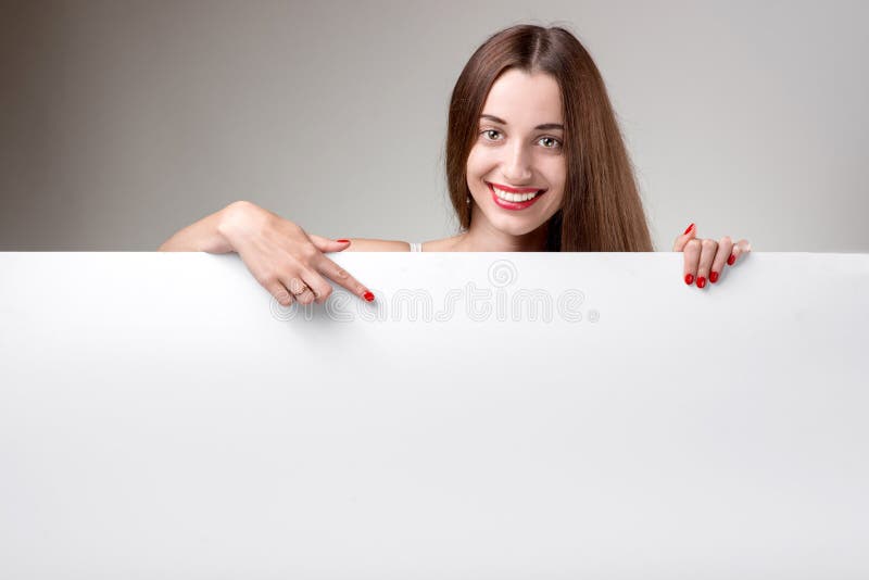 Woman Pointing On White Billboard Over Grey Stock Photo - Image of ...