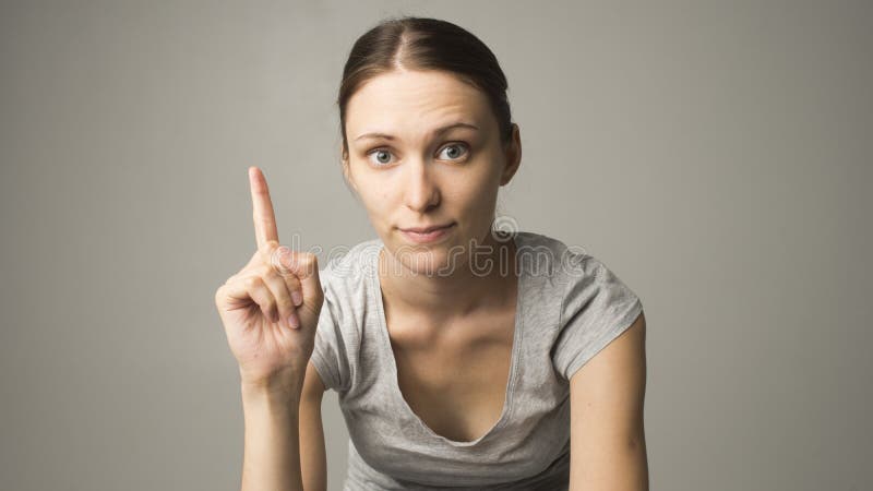 Woman Points Her Fingers at Something Stock Photo - Image of beautiful ...