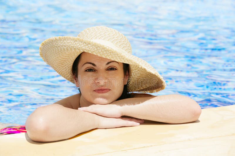 Woman at the pool stock image. Image of resort, fashion - 23765661