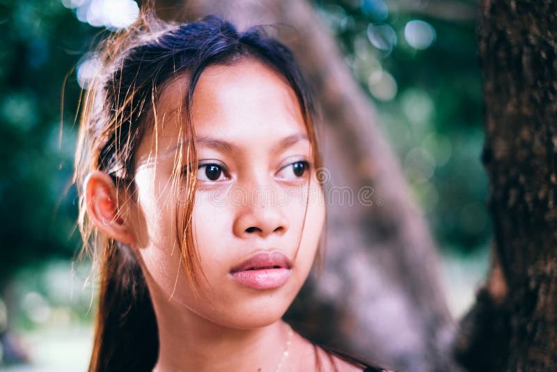 Woman Portrait Of Lovely And Beautiful Asian Young Girl Outdoor On The Tree In The Park Stock