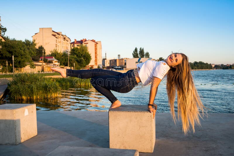 Woman Posing at Lakeshore Sitting at Cube Stock Image - Image of female ...